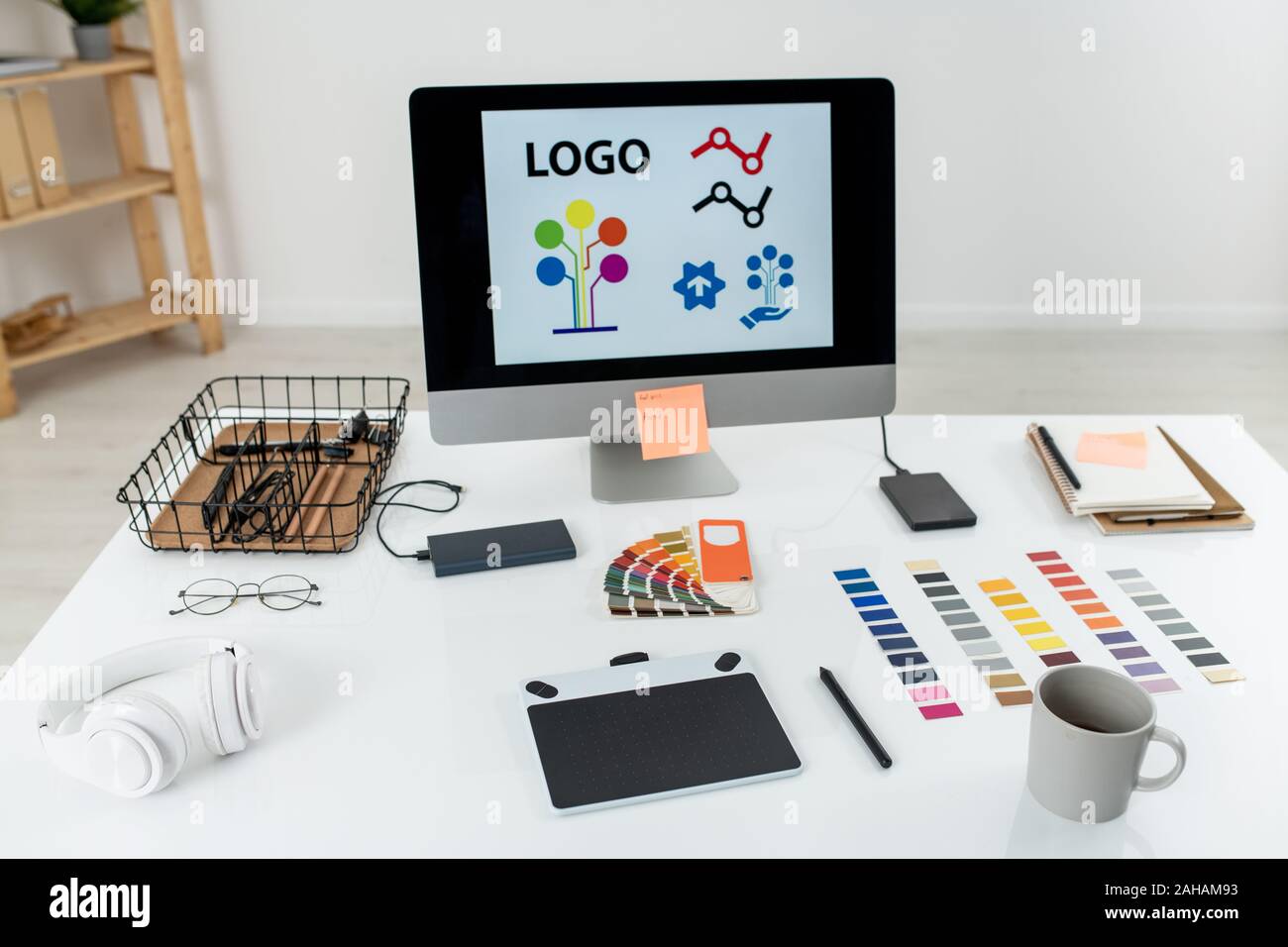 Computer monitor with logo on screen, graphics tablet and other stuff ...
