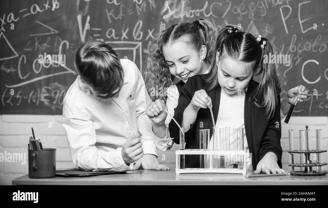 Happy children. Chemistry lesson. Little kids learning chemistry ...