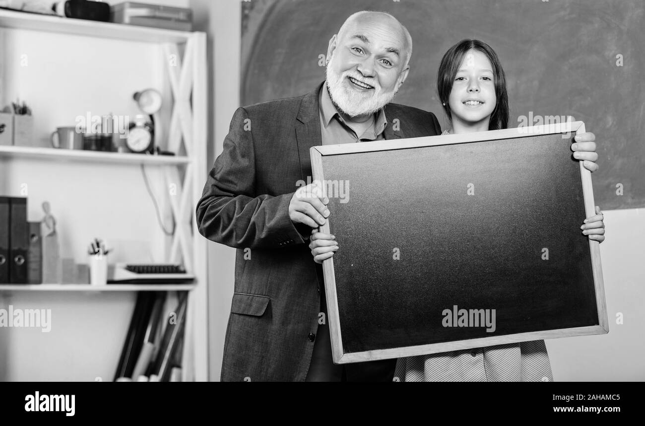 Better School for Better Tomorrow. mature teacher and happy pupil girl ...