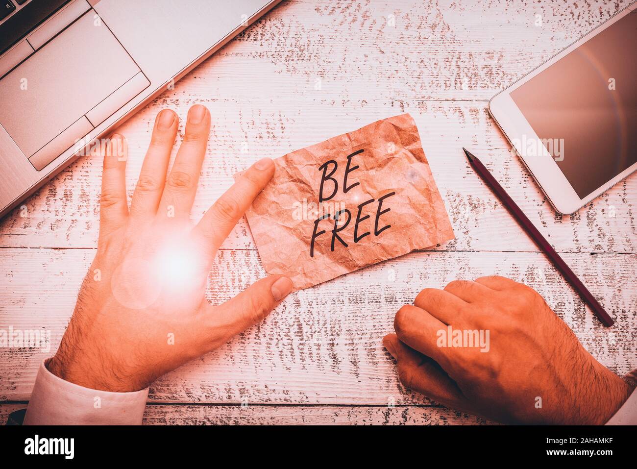 Writing note showing Be Free. Business concept for ability to do ...
