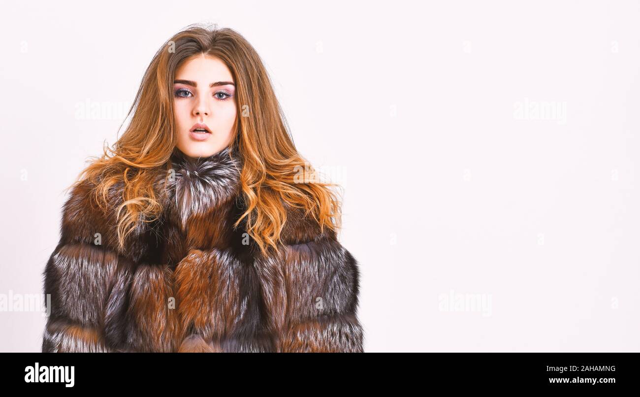 Fur store model posing in soft fluffy warm coat. Pretty fashionista ...