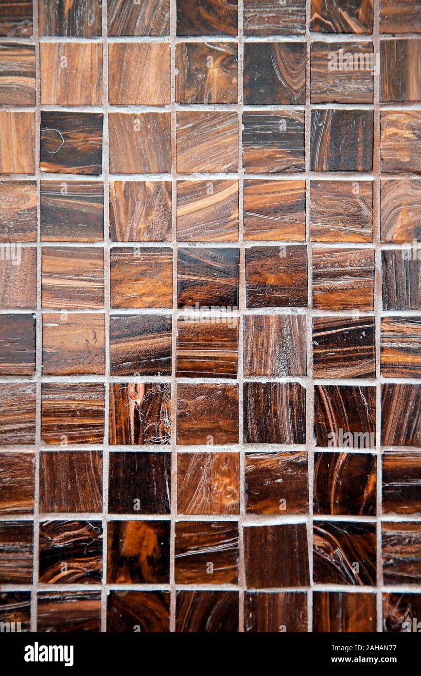 Small square mosaic tiles made from brown marble Stock Photo - Alamy