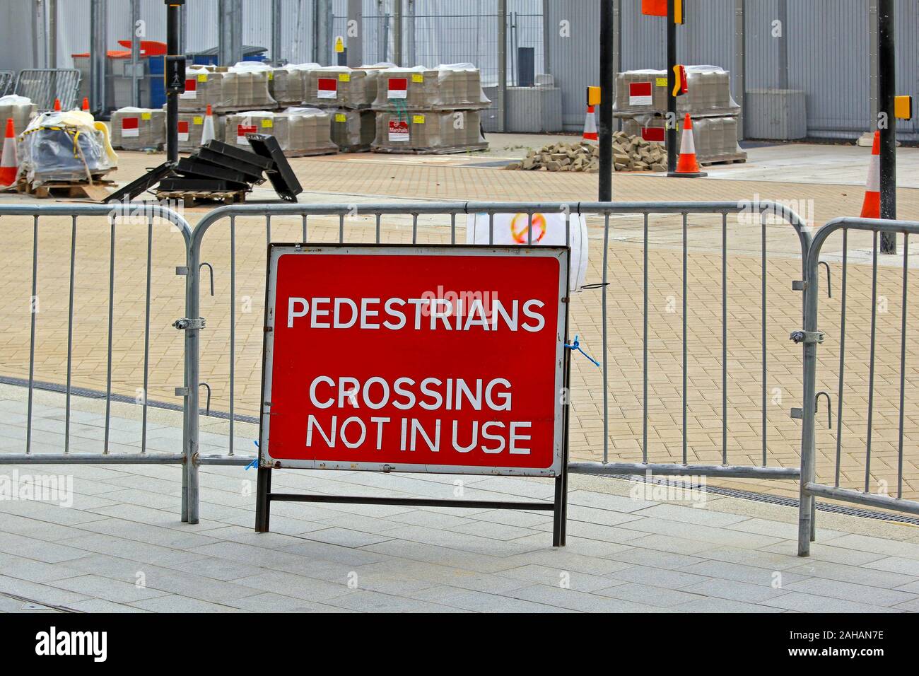 Pedestrian crossing not in use red sign and fence Stock Photo - Alamy