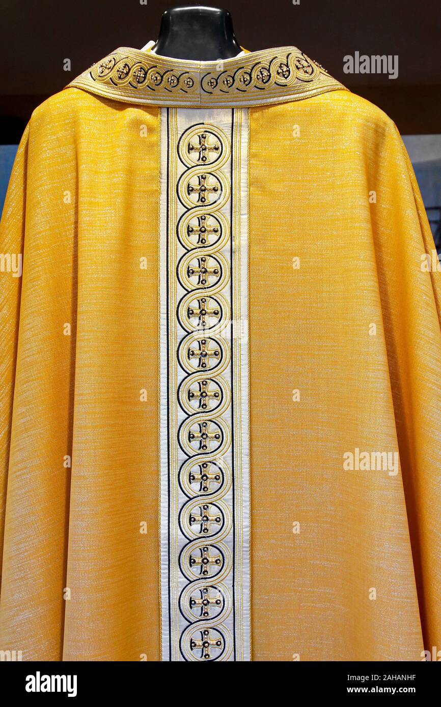 Golden mantle for Catholic priest with cross pattern Stock Photo - Alamy