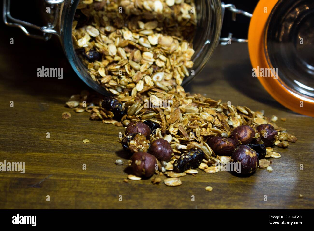 Jar with granola, muesli. Homemade multigrain granola with a nuts in a ...