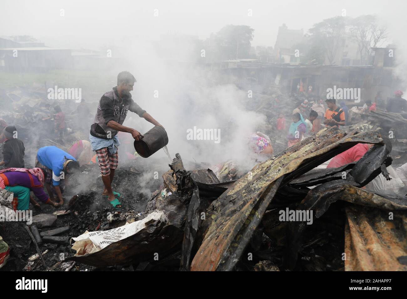 Dhaka, Bangladesh. 27th Dec, 2019. A fire ravaged over 100 shanties of ...