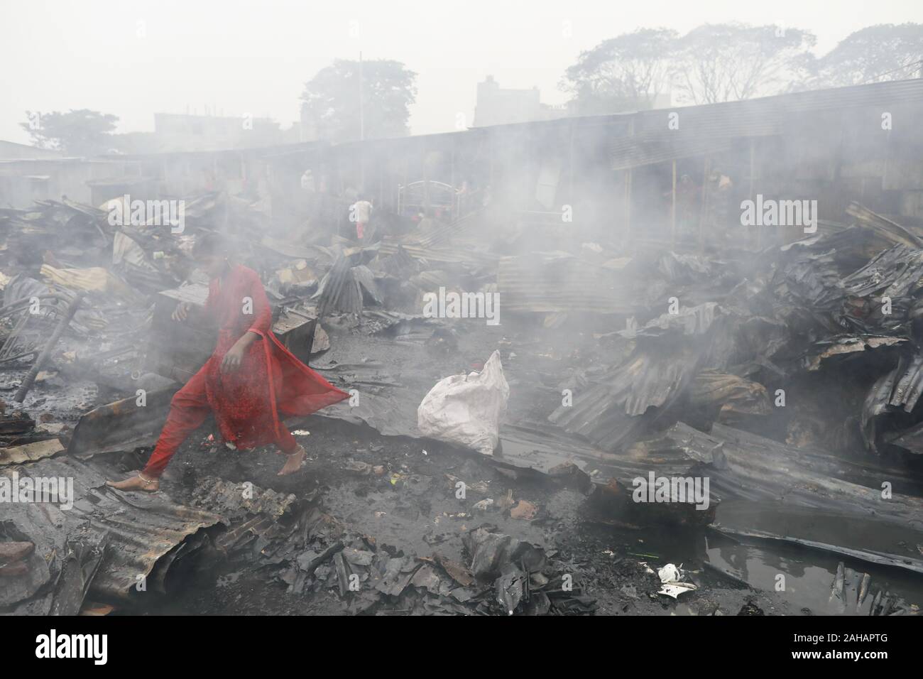Dhaka, Bangladesh. 27th Dec, 2019. A fire ravaged over 100 shanties of ...