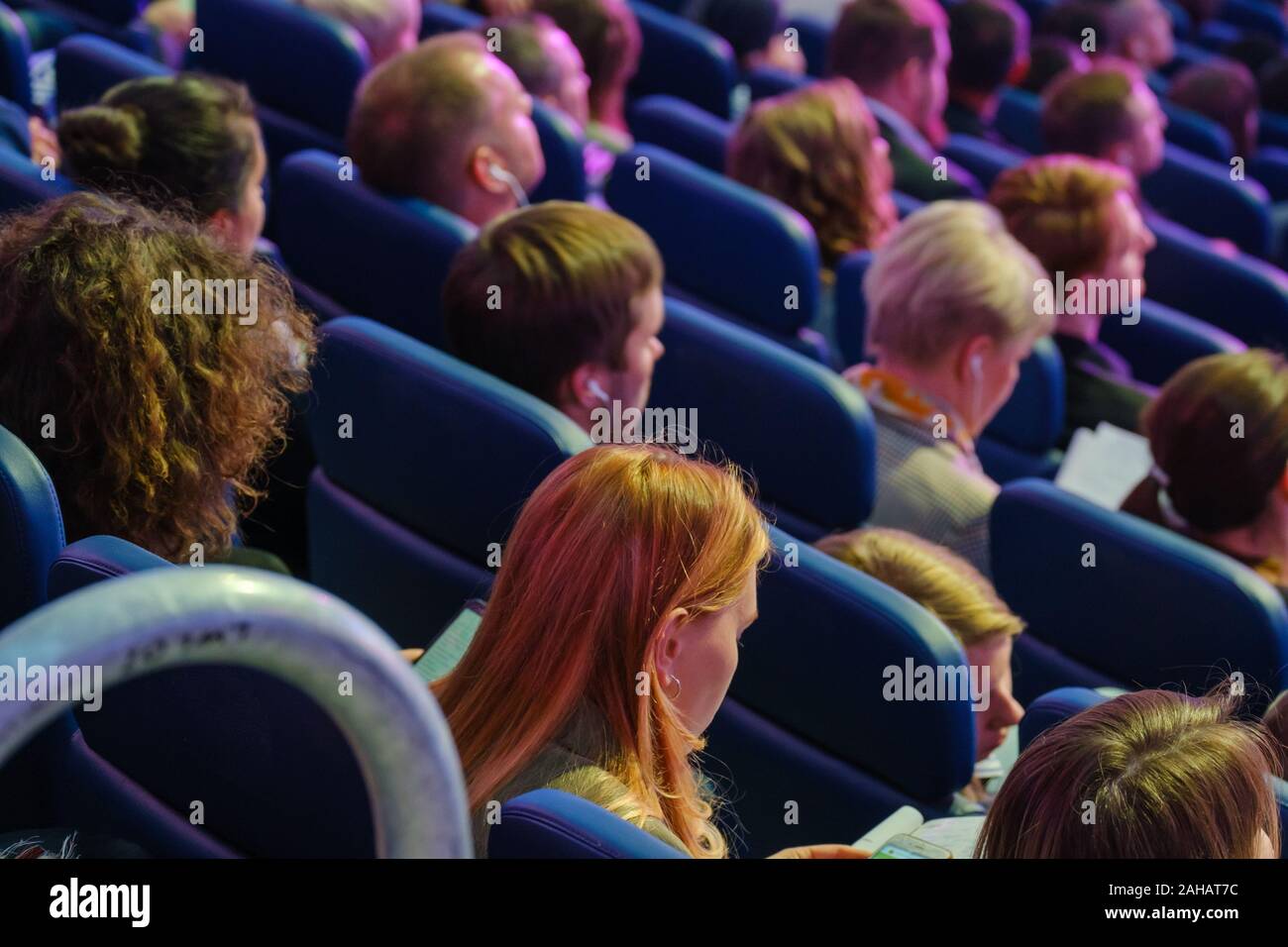 Business conference attendees sit and listen Stock Photo - Alamy