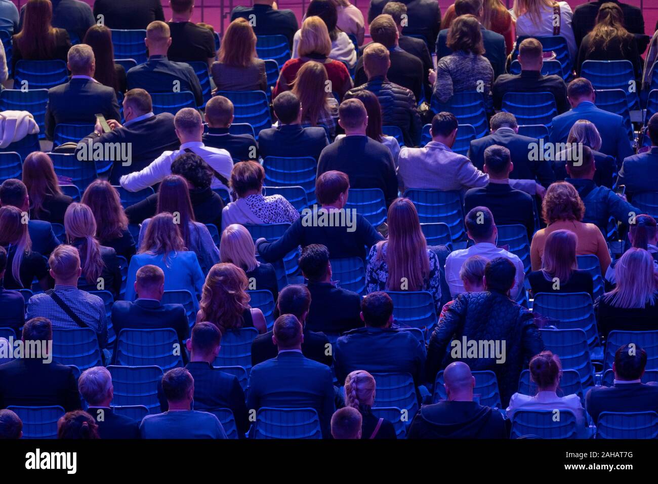 Business conference attendees sit and listen Stock Photo - Alamy