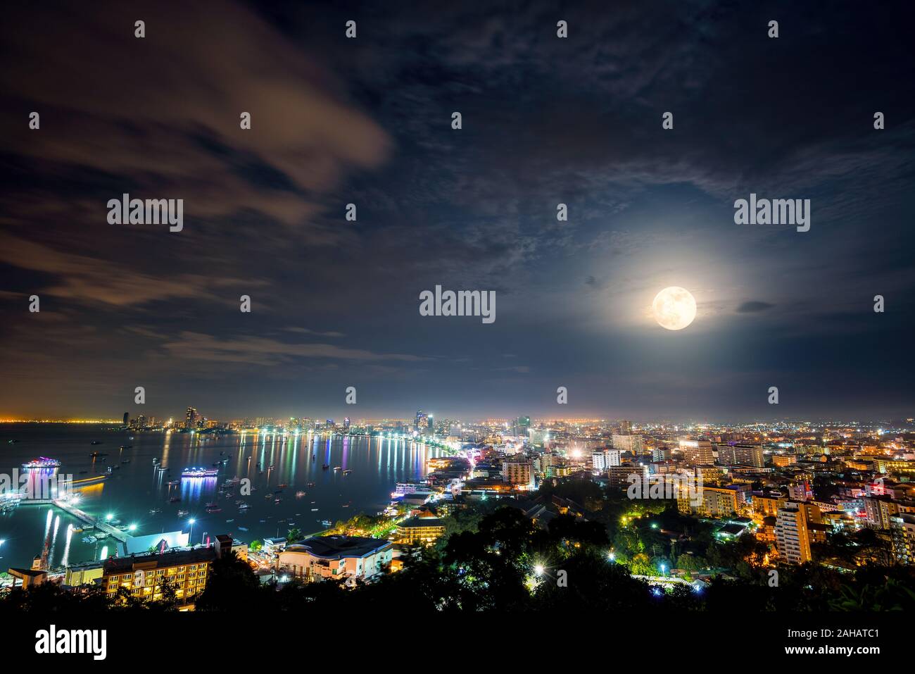 High view on viewpoint full moon above cityscape with colorful light at ...