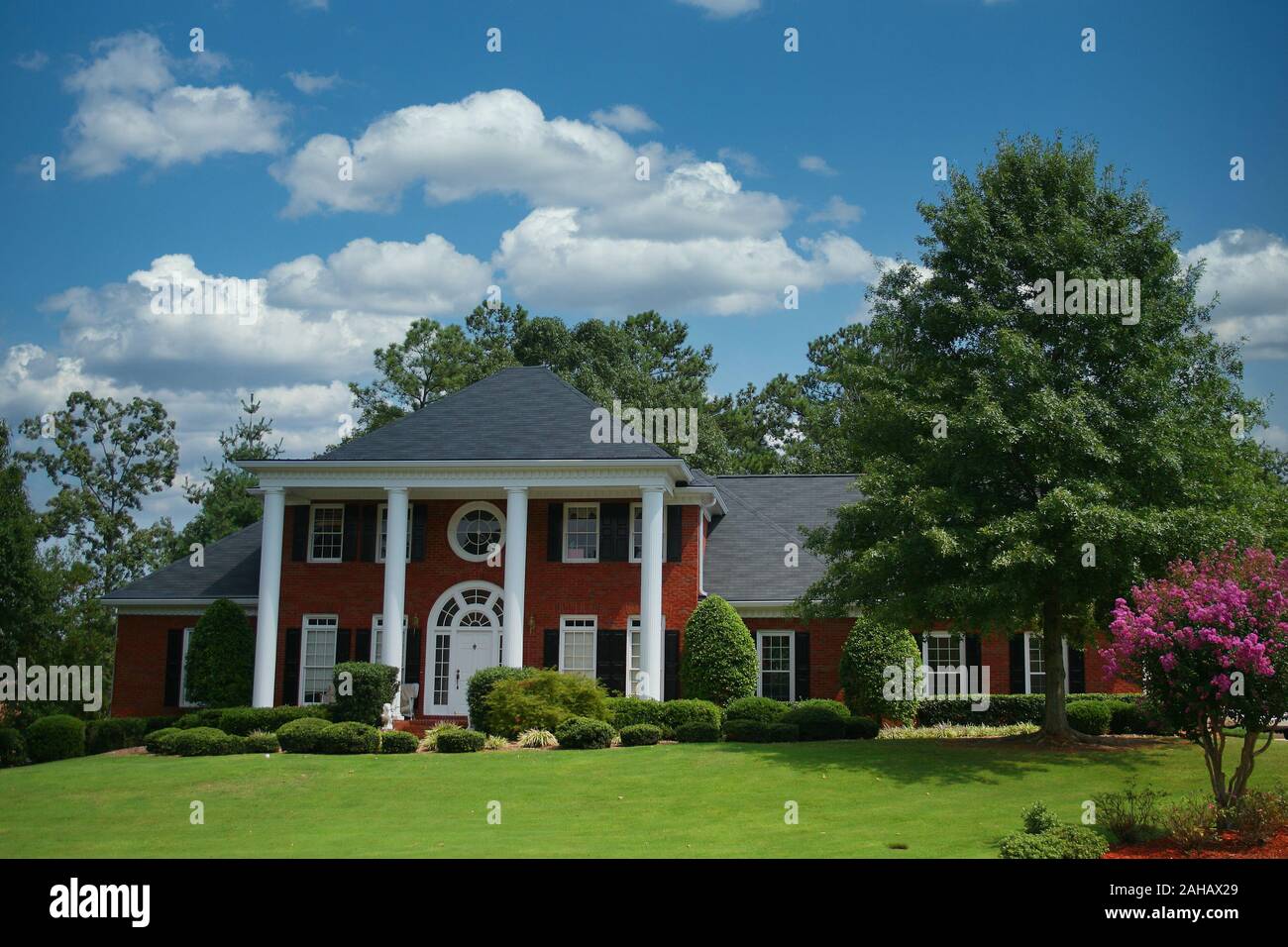 Columns on Nice Brick Home Stock Photo - Alamy