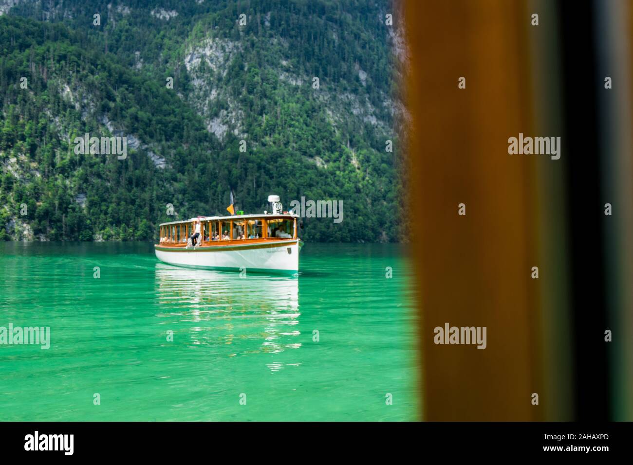A tourist boat at the Koenigssee lake (Königssee) from the window of ...