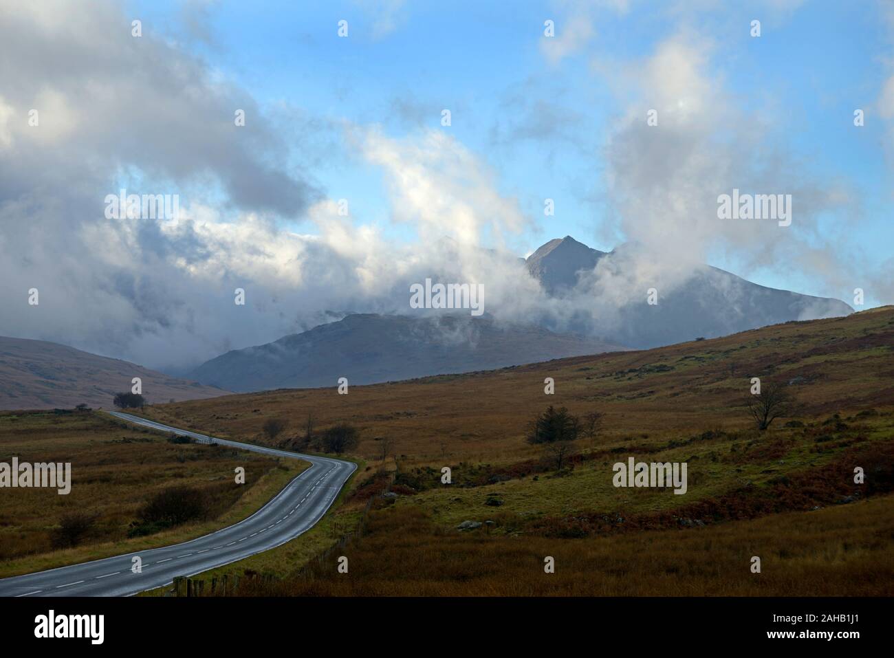 Snowdon with clouds looking along A4086 Stock Photo - Alamy