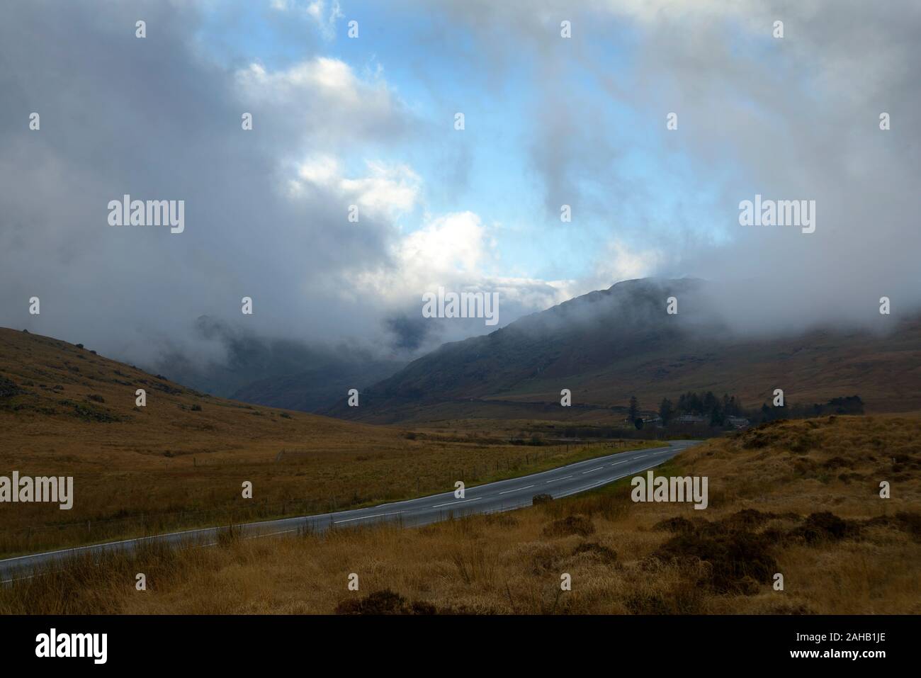 Snowdon with clouds looking along A4086 Stock Photo - Alamy