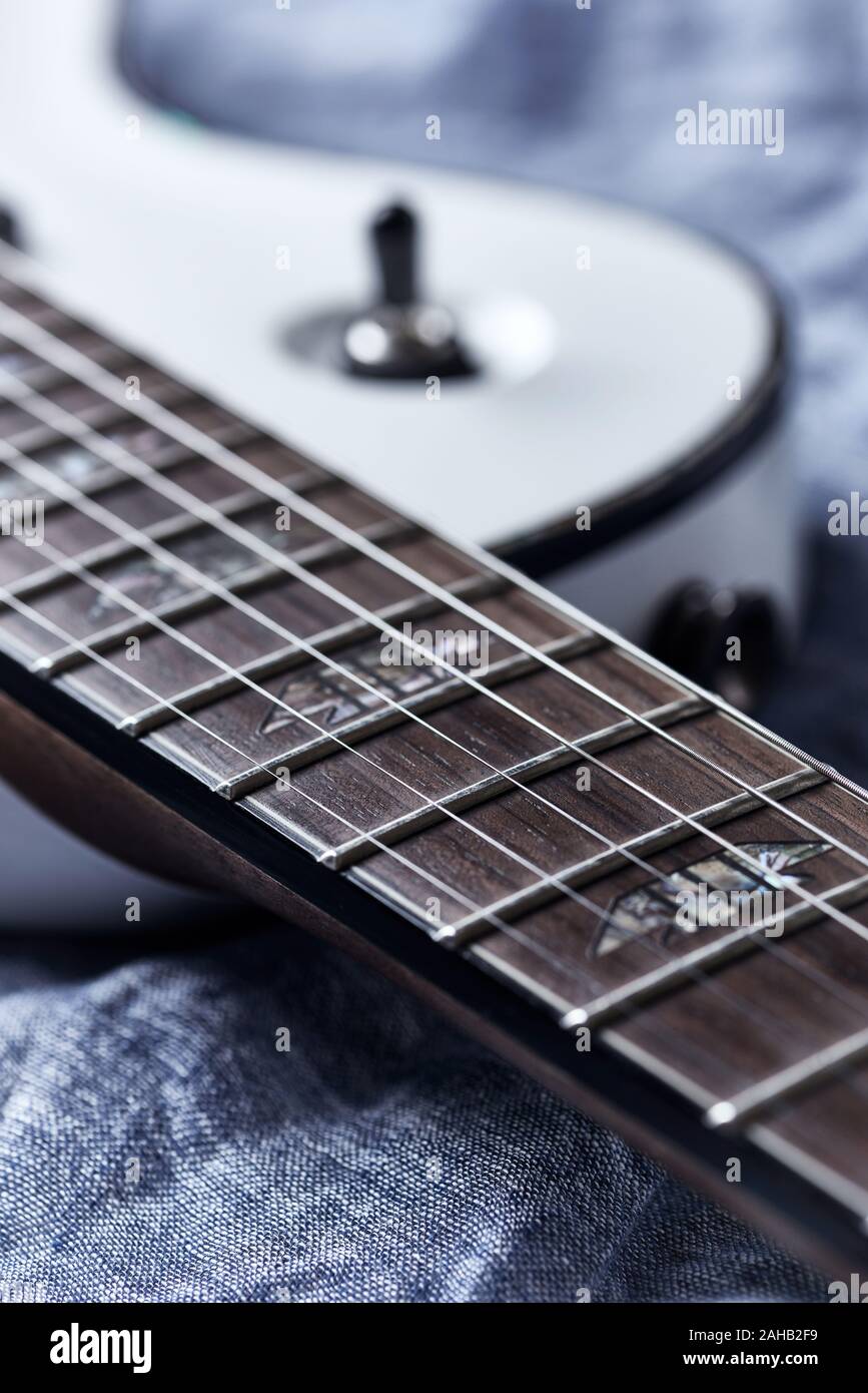 Fretboard of modern electric guitar. Close up Stock Photo - Alamy