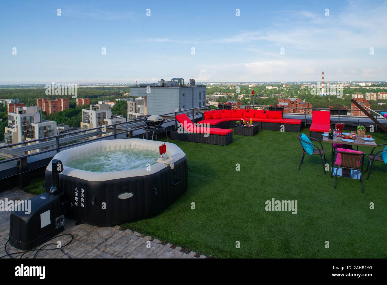 Outdoor jacuzzi in relax zone on the rooftop terrace in modern living ...