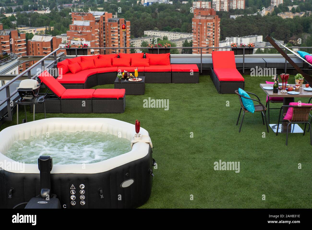 Outdoor jacuzzi in relax zone on the rooftop terrace in modern living ...