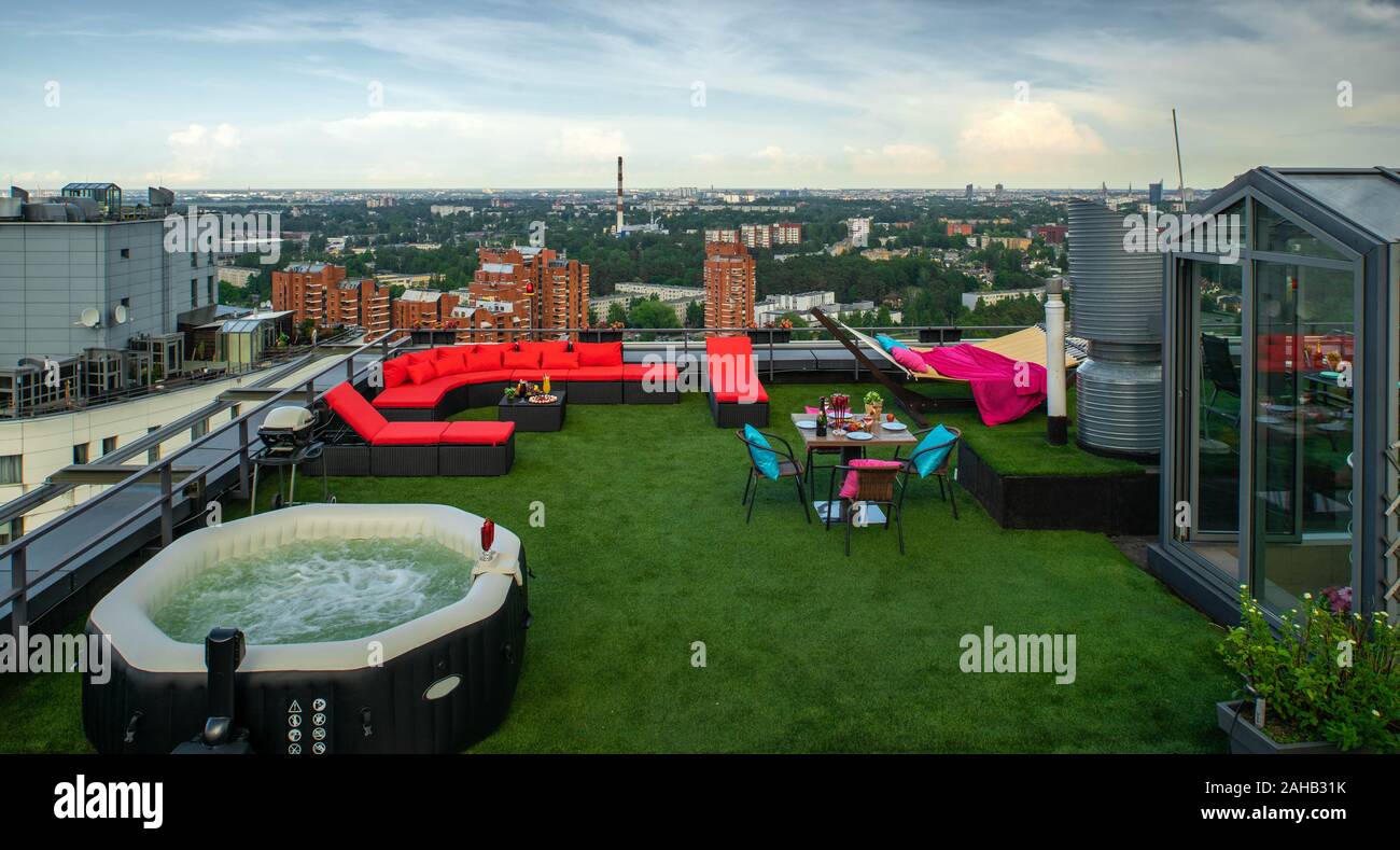 Outdoor jacuzzi in relax zone on the rooftop terrace in modern living ...