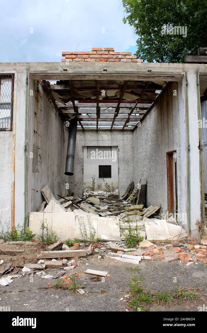 Destroyed tall garage at abandoned industrial complex with missing ...
