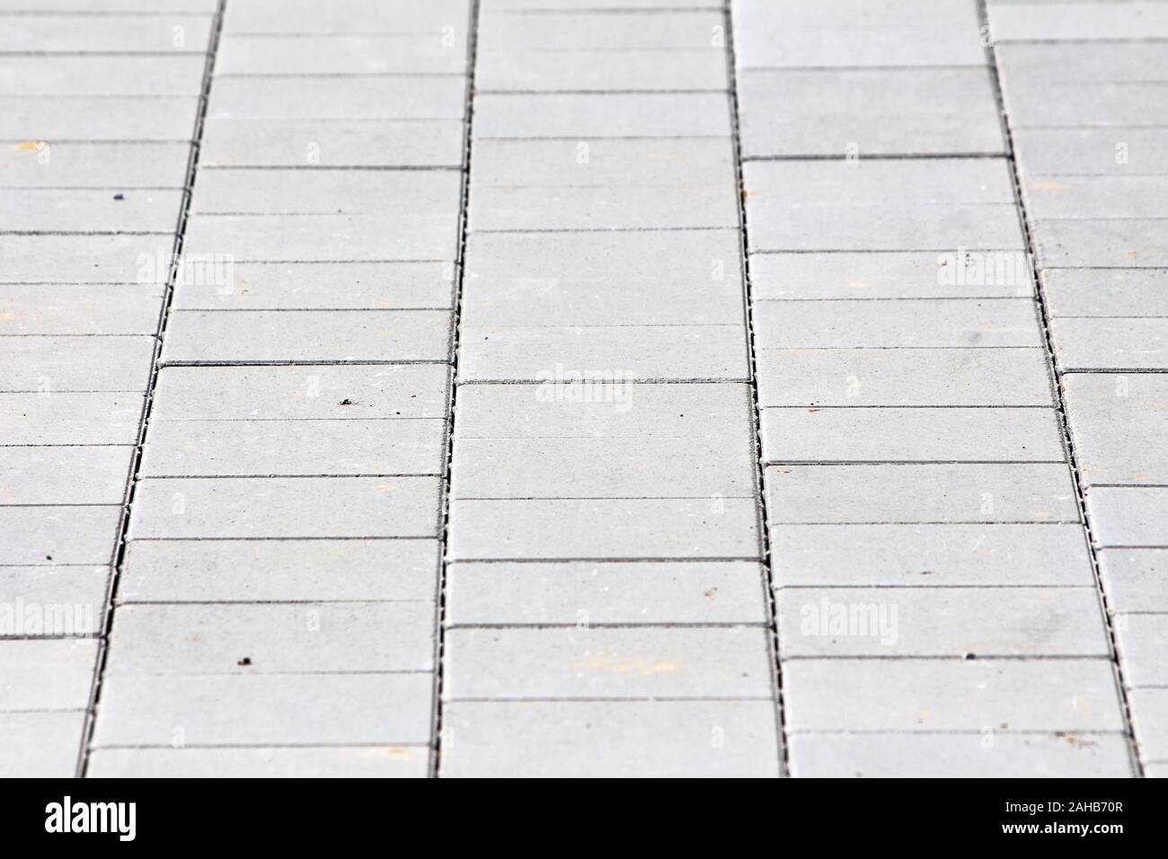 Grey rectangle stone tiles texture at local public park sidewalk on ...