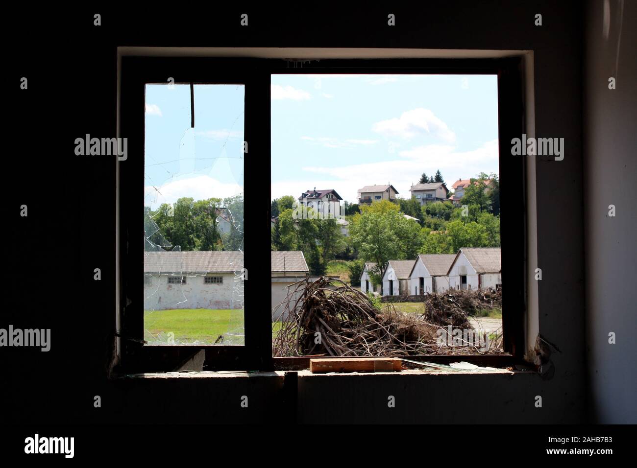 Large and small windows with broken and missing glass at abandoned ...