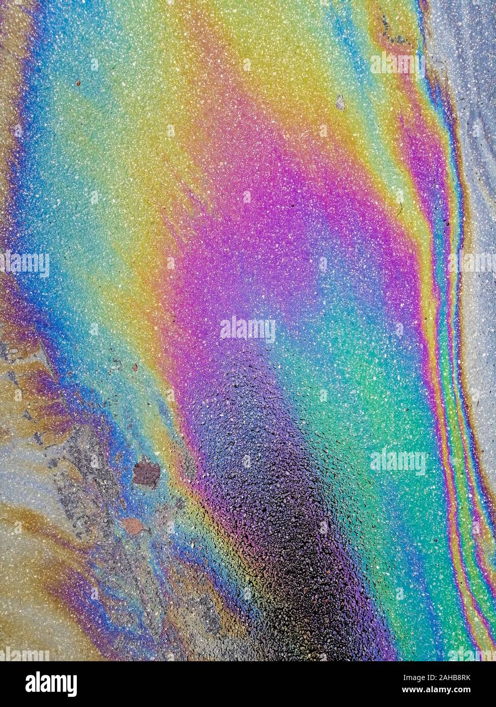 Multi colored oil spill on asphalt road, abstract background Stock ...