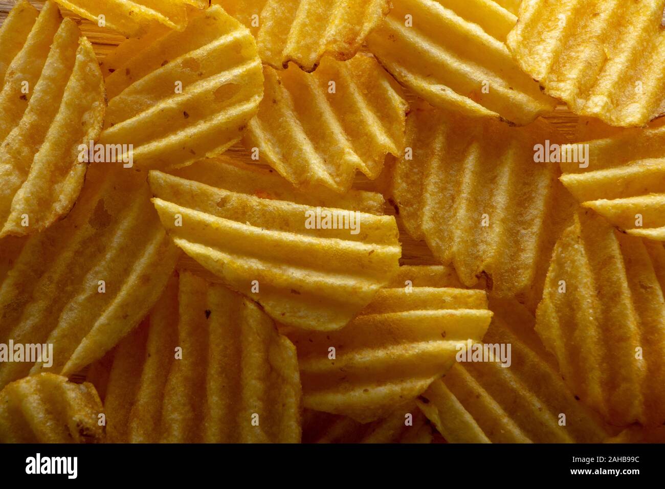 Texture fried golden brown potato chips, close-up Stock Photo - Alamy