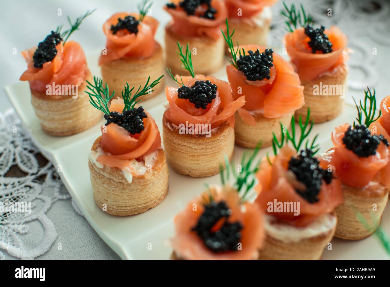 smoked salmon canape with black caviar Stock Photo - Alamy