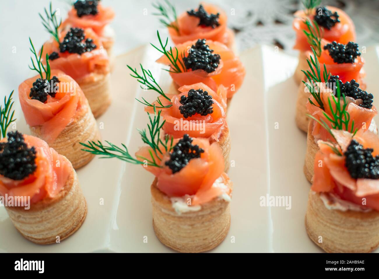 smoked salmon canape with black caviar Stock Photo - Alamy