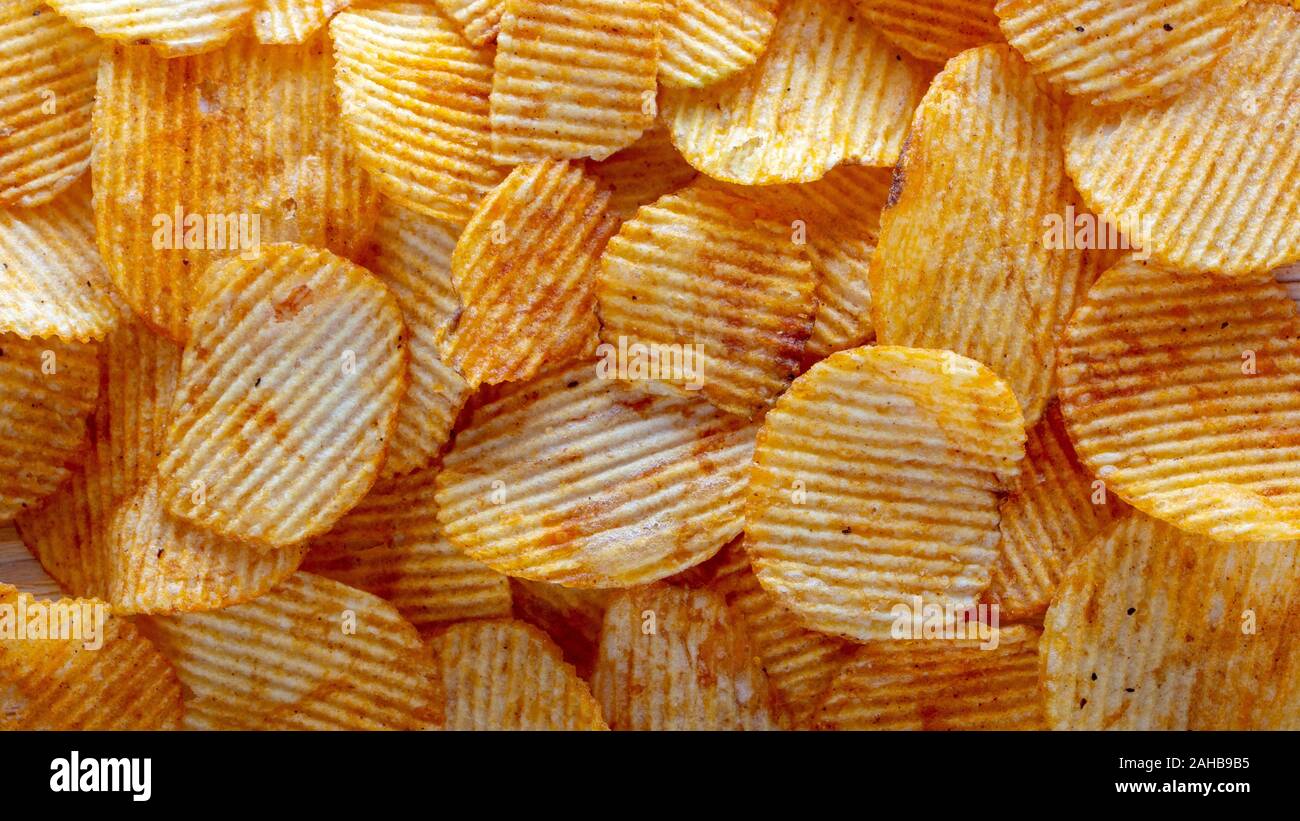 Texture fried golden brown potato chips, close-up Stock Photo - Alamy