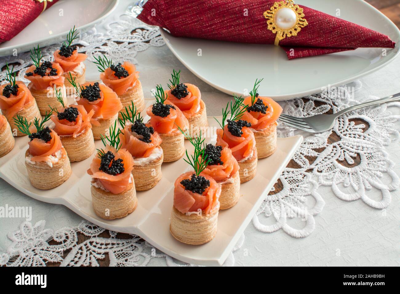 smoked salmon canape with black caviar Stock Photo - Alamy