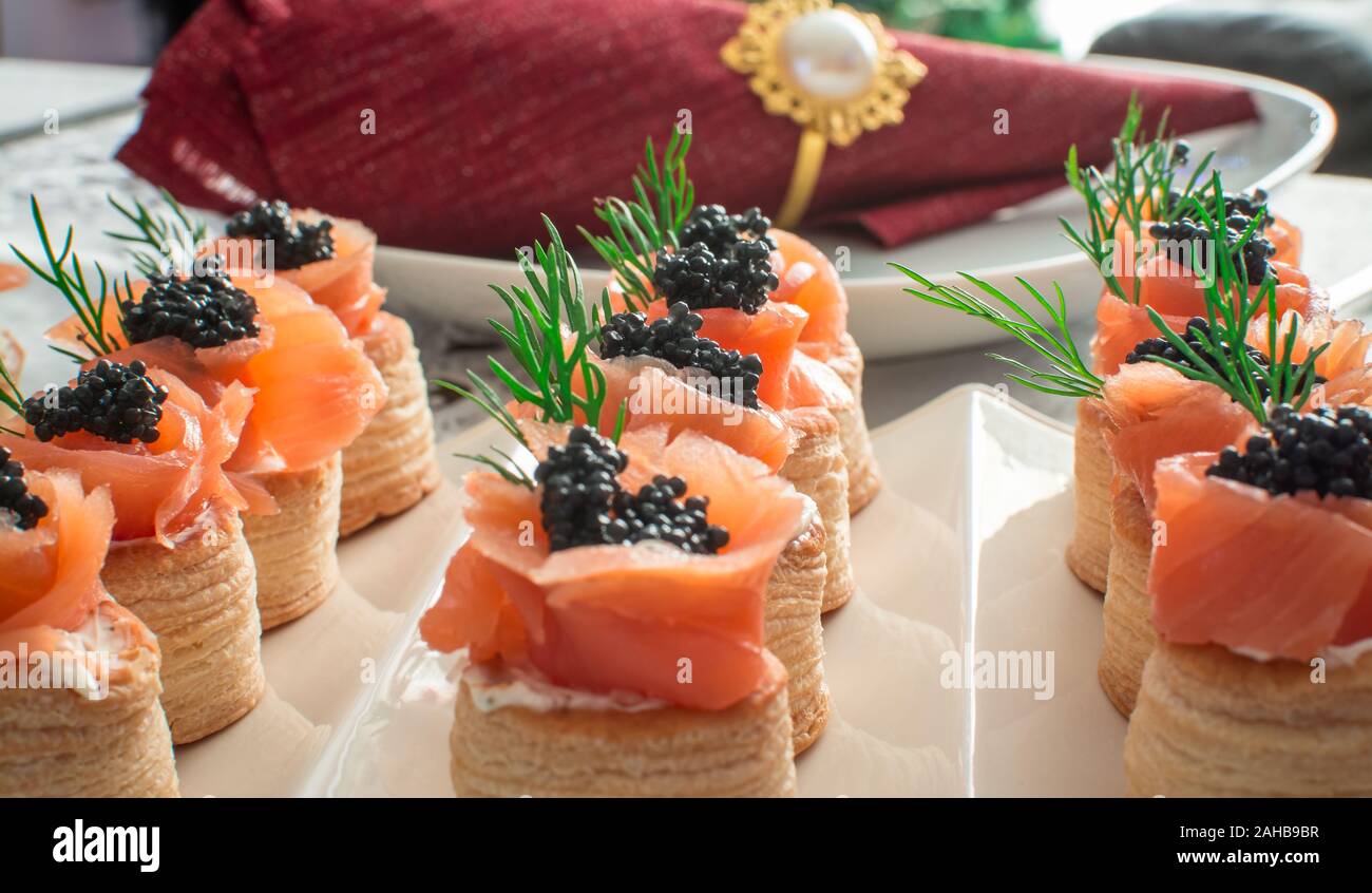 smoked salmon canape with black caviar Stock Photo - Alamy