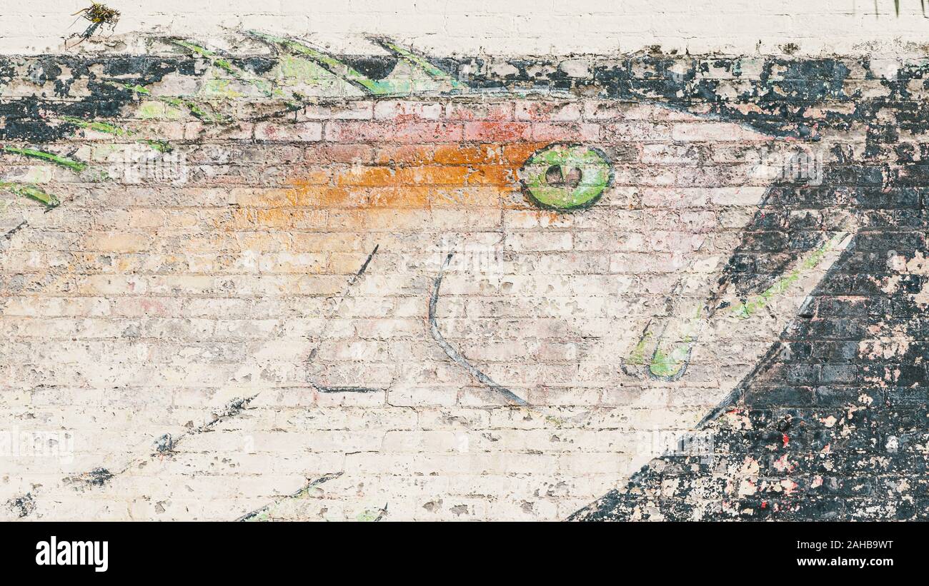 Fish mural on brick wall street art background texture Stock Photo - Alamy