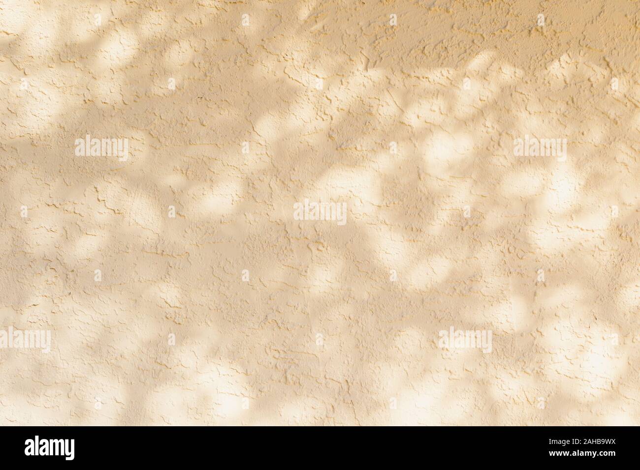 Light and shadow on cream concrete wall background backdrop texture ...