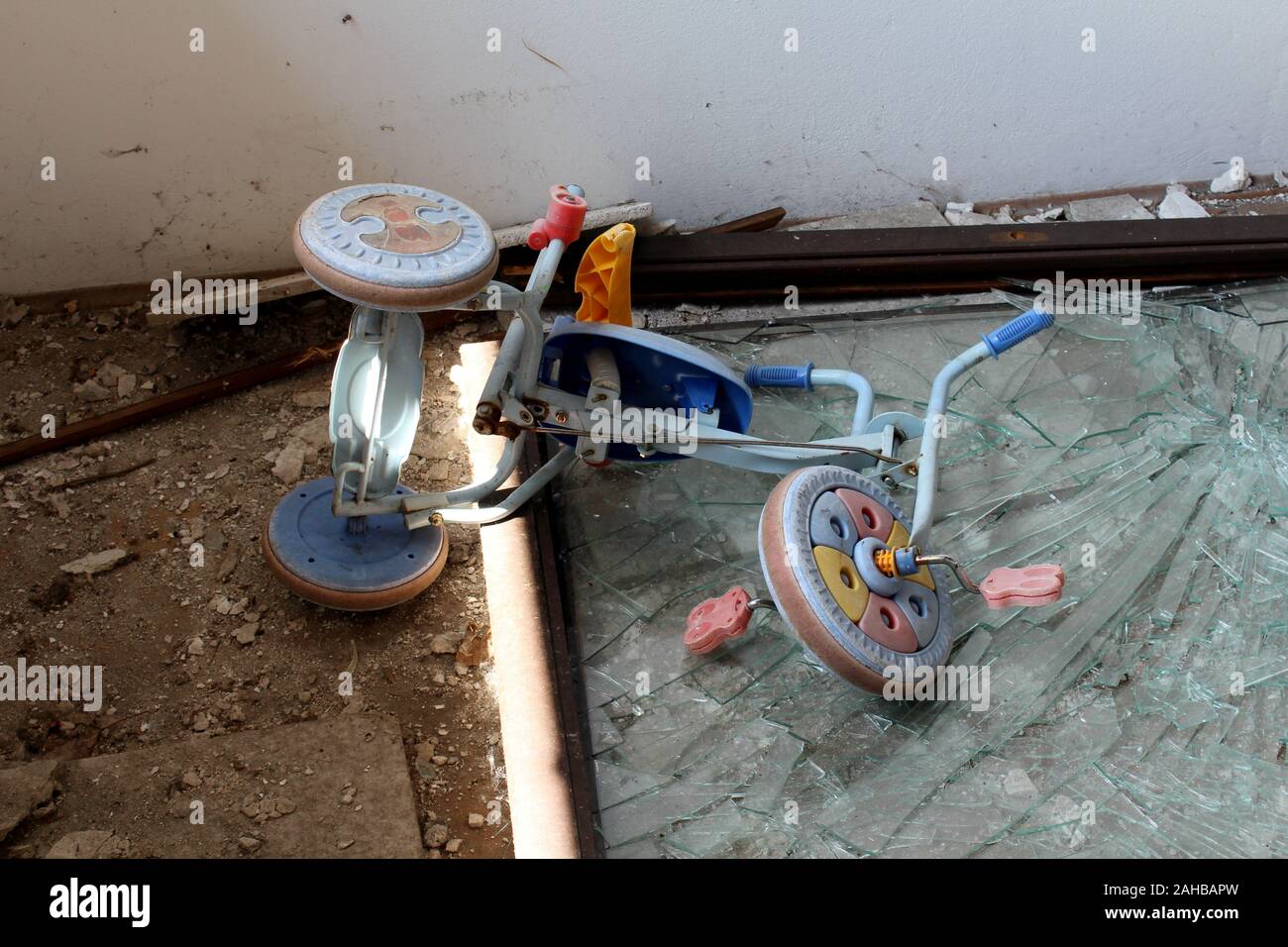 Vintage retro metal and plastic colorful broken children tricycle left ...