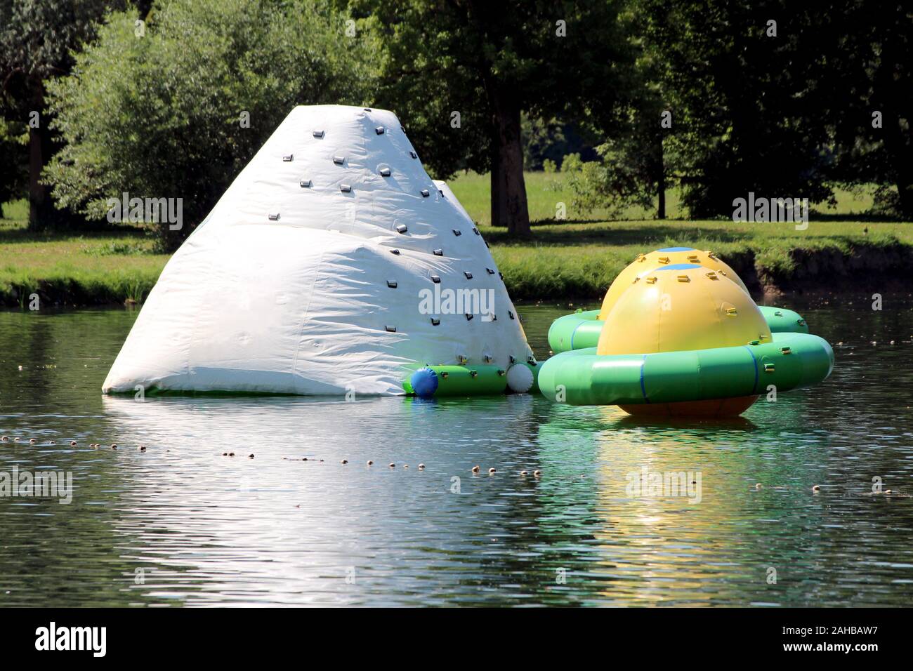 White and yellow green inflatable floating climbing walls in different ...