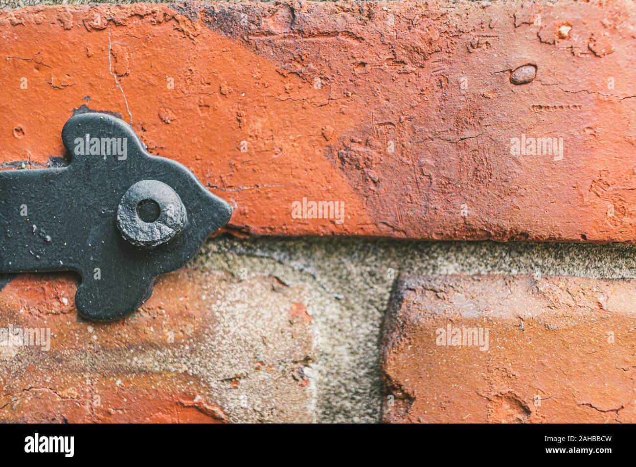 Vintage brick wall iron fastener background texture Stock Photo - Alamy
