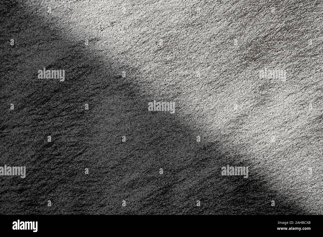 Sun and shade on a volcanic basalt sand beach Stock Photo - Alamy