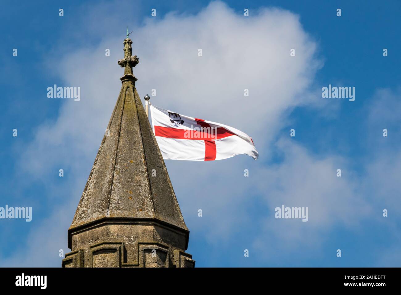 St George's flag flying from the top of a church spire Stock Photo - Alamy