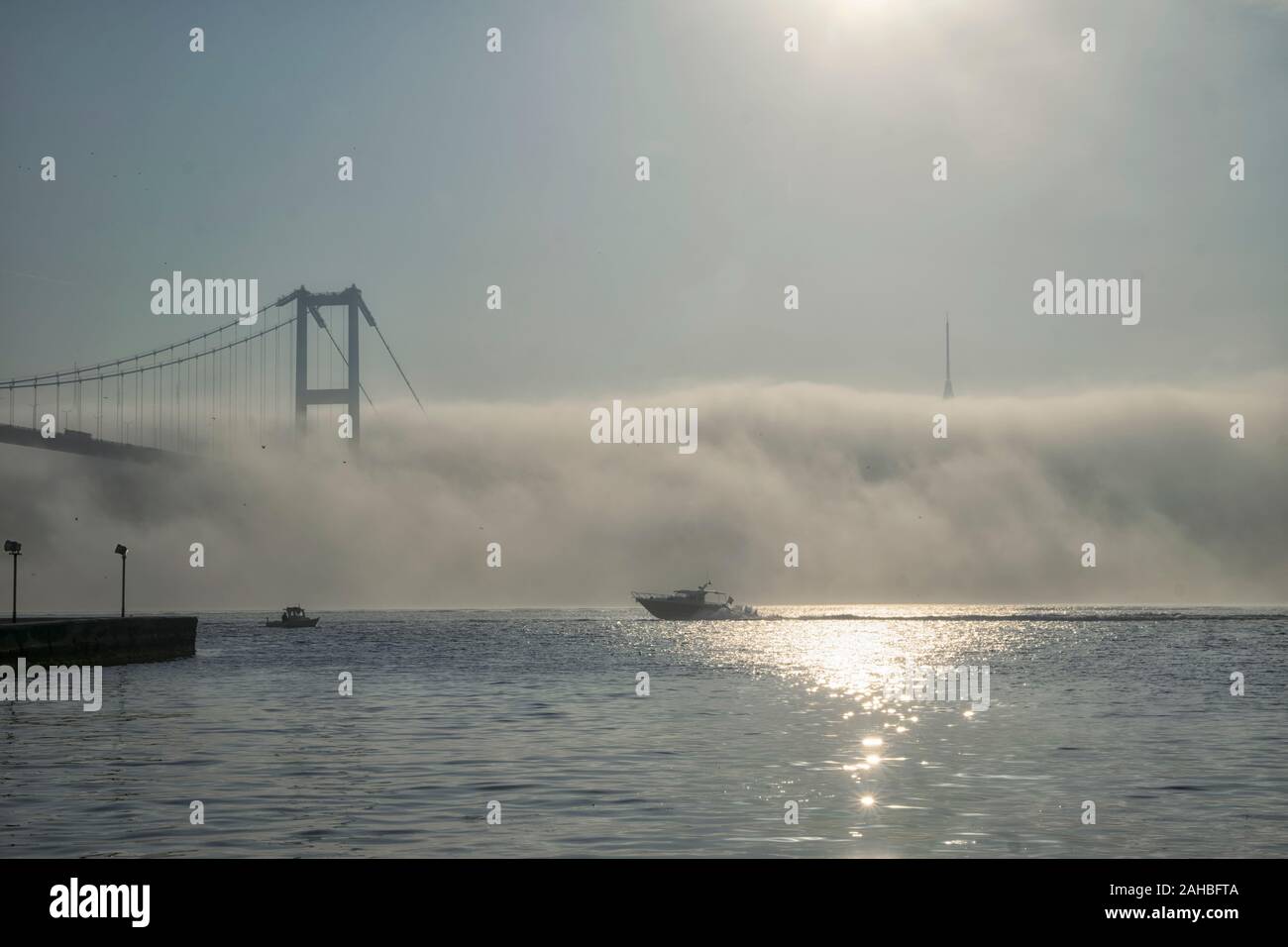 Bosphorus Bridge and Speed Boat in foggy morning Istanbul Turkey Stock ...