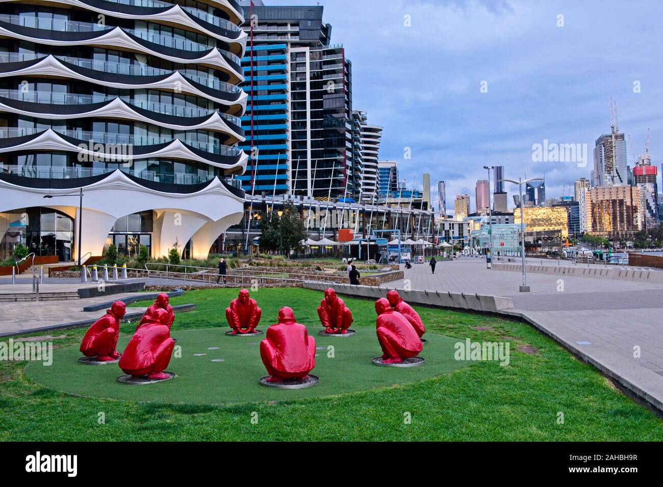 Red crouching men sculpture hi-res stock photography and images - Alamy