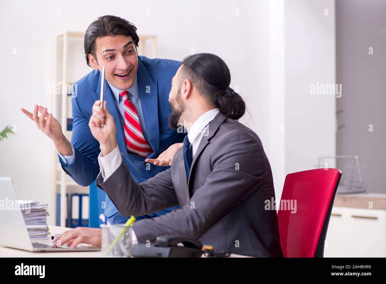 The two male colleagues in the office Stock Photo - Alamy