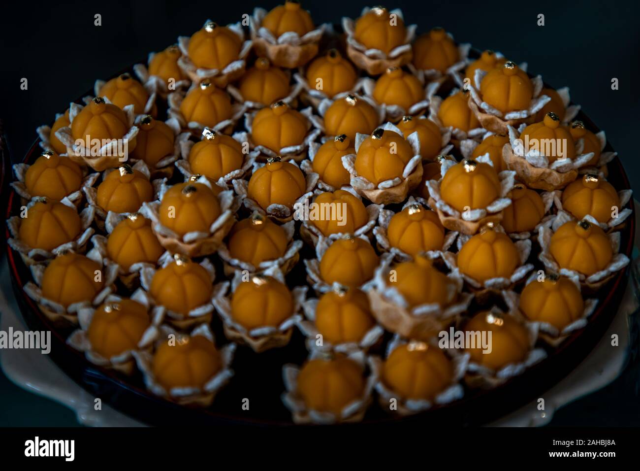 Elegantly beautiful Thai Desserts (Khanom Wan Thai) serving on a wooden ...