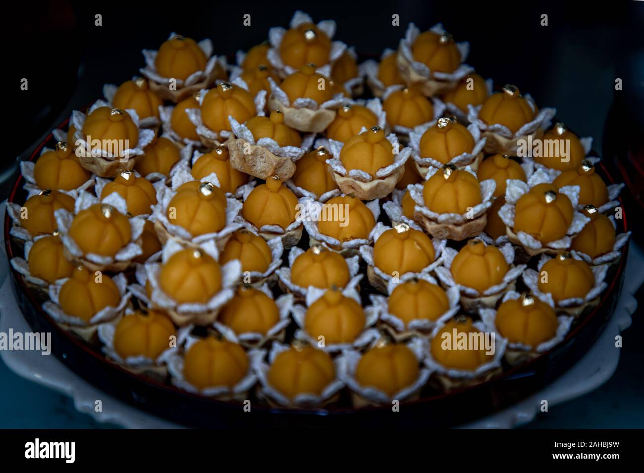 Elegantly beautiful Thai Desserts (Khanom Wan Thai) serving on a wooden ...
