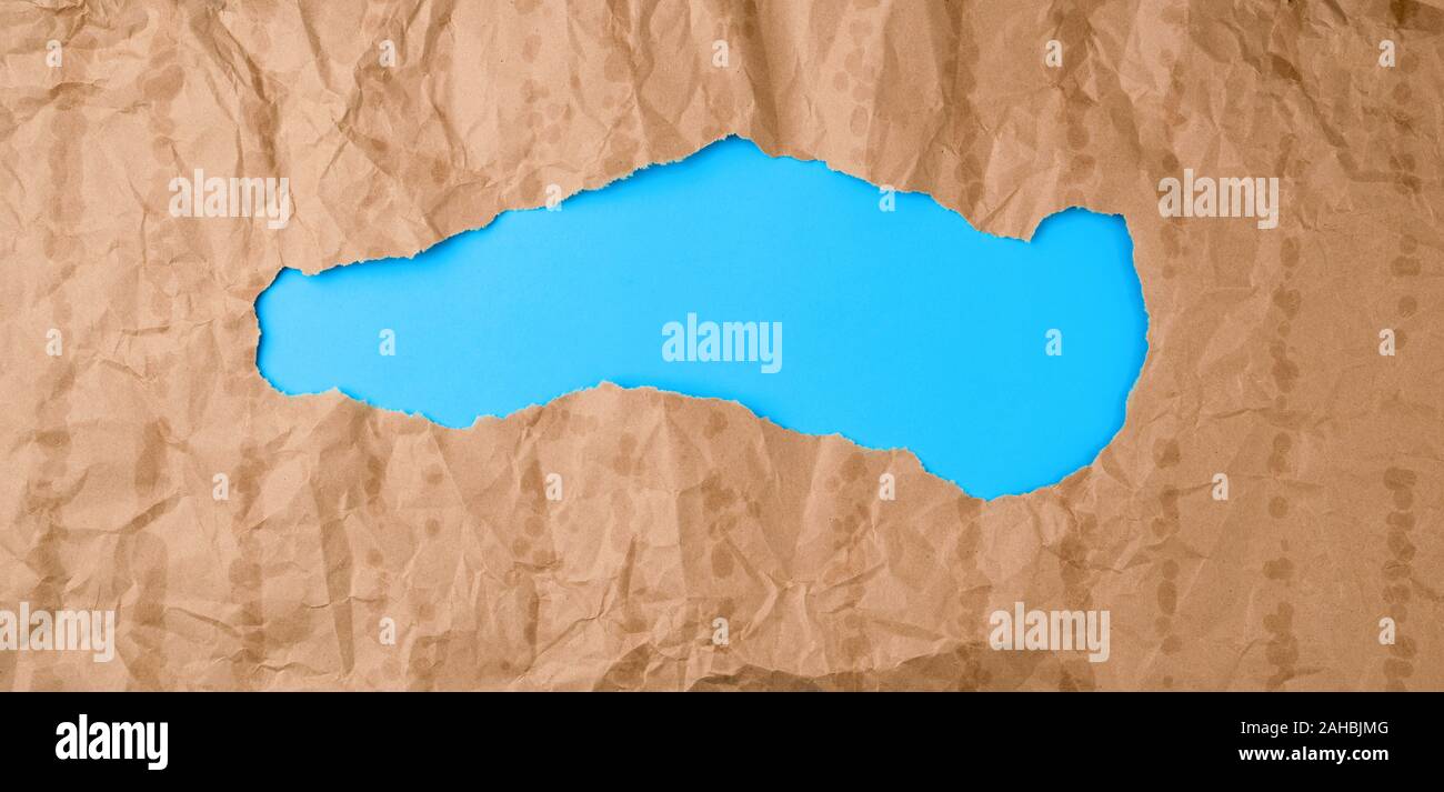 crumpled paper texture from a brown sheet of paper with greasy spots ...