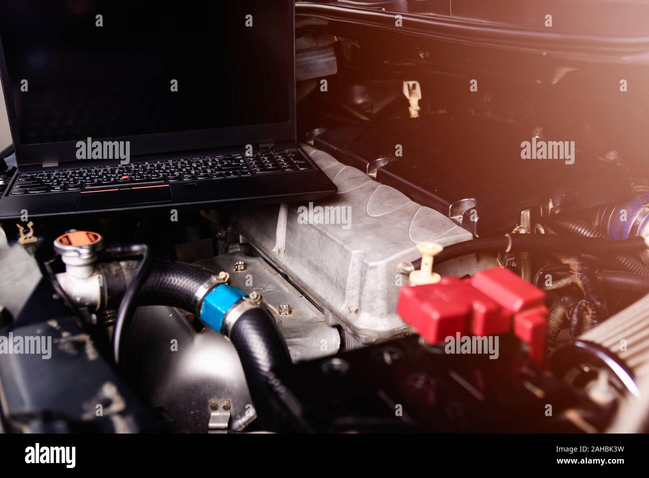 Laptop computer on car mechanic engine for service at workshop Stock ...