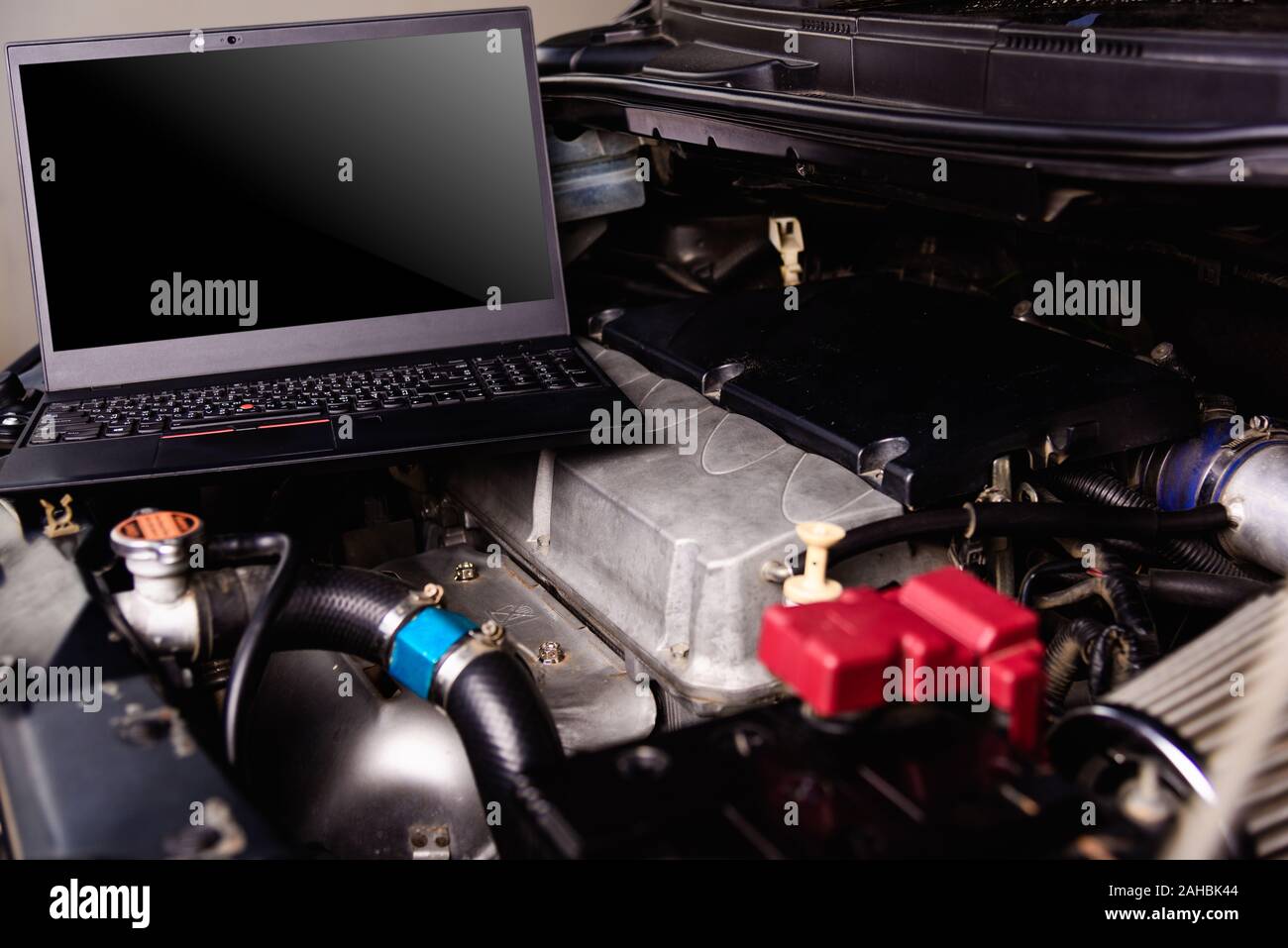 Laptop computer on car mechanic engine for service at workshop Stock ...