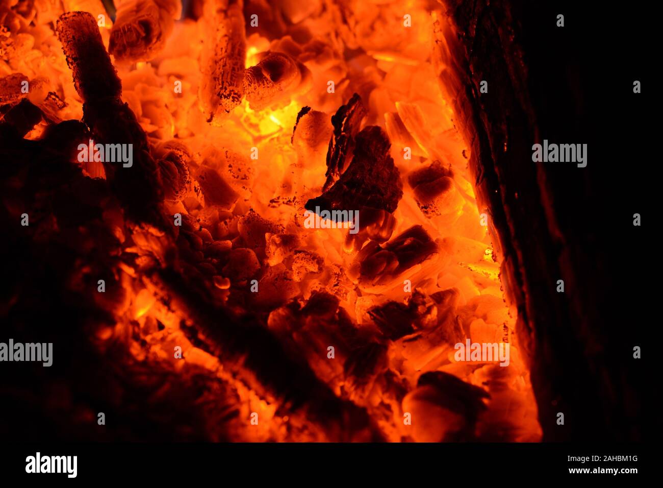 The hot coals of a burning bonfire close-up. Abstract background Stock ...