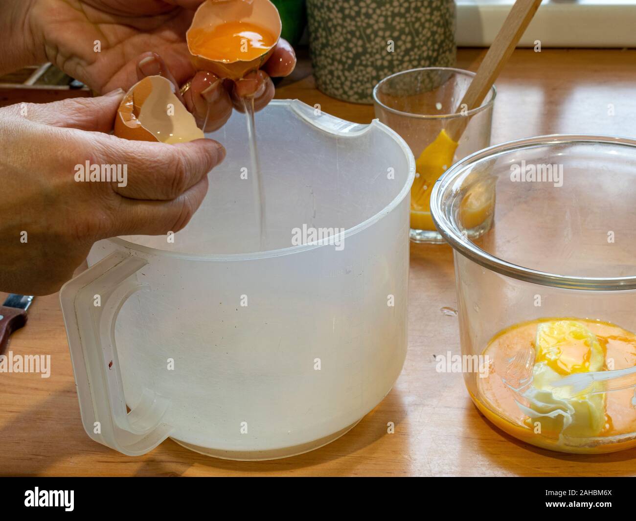 home baked biscuits, breaking eggs and preparation by whipping Stock ...