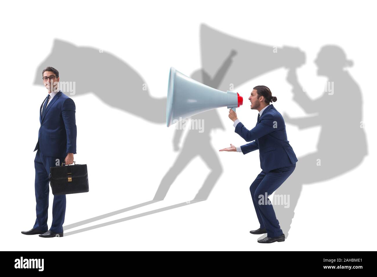 Businessman shouting through the large loudspeaker Stock Photo - Alamy